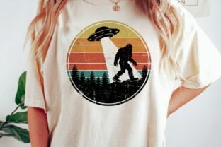 Bigfoot Ufo Abduction Retro Sunset Graphic by gregoraciiart · Creative ...